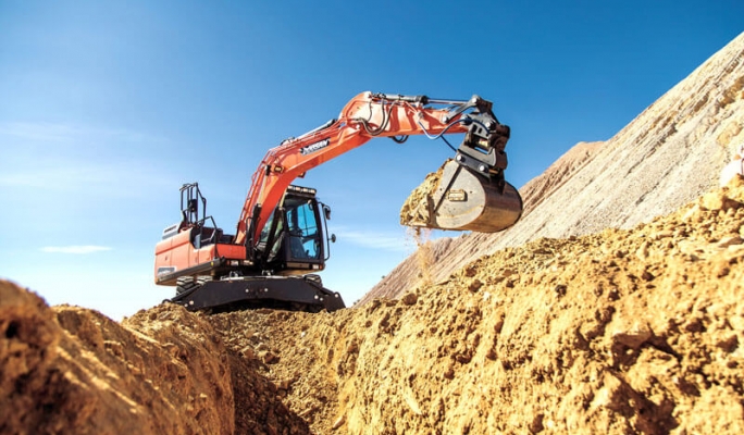 Man seriously injured after getting caught in industrial excavator